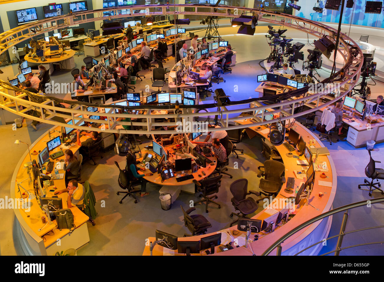 Journalists work in the newsroom of the Arabic news broadcaster Al ...