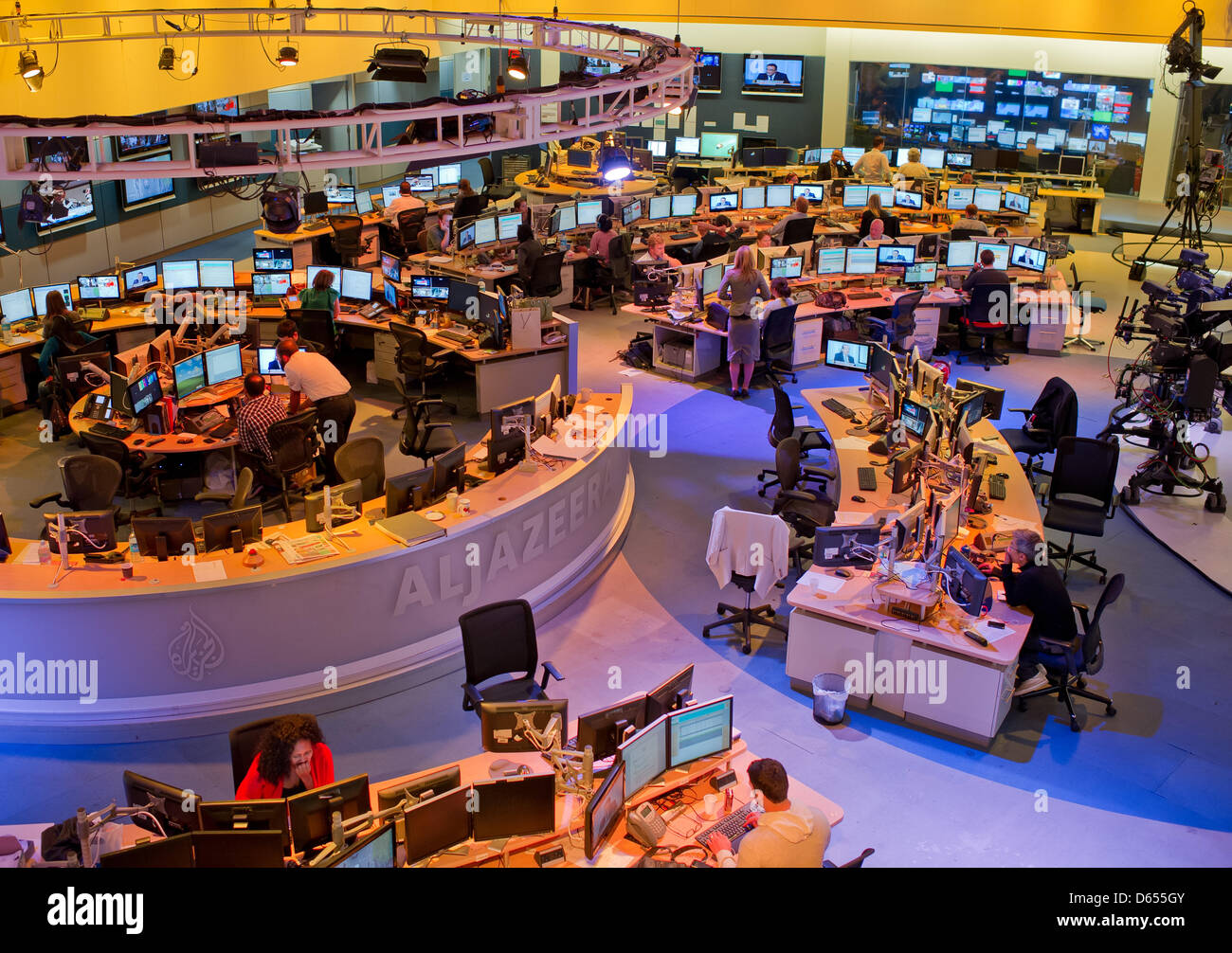 Journalists work in the newsroom of the Arabic news broadcaster Al ...