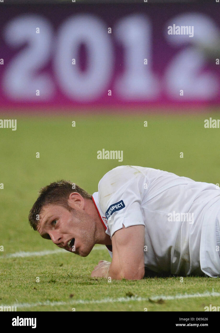 England's James Milner lies on the pitch vduring UEFA EURO 2012 group D ...