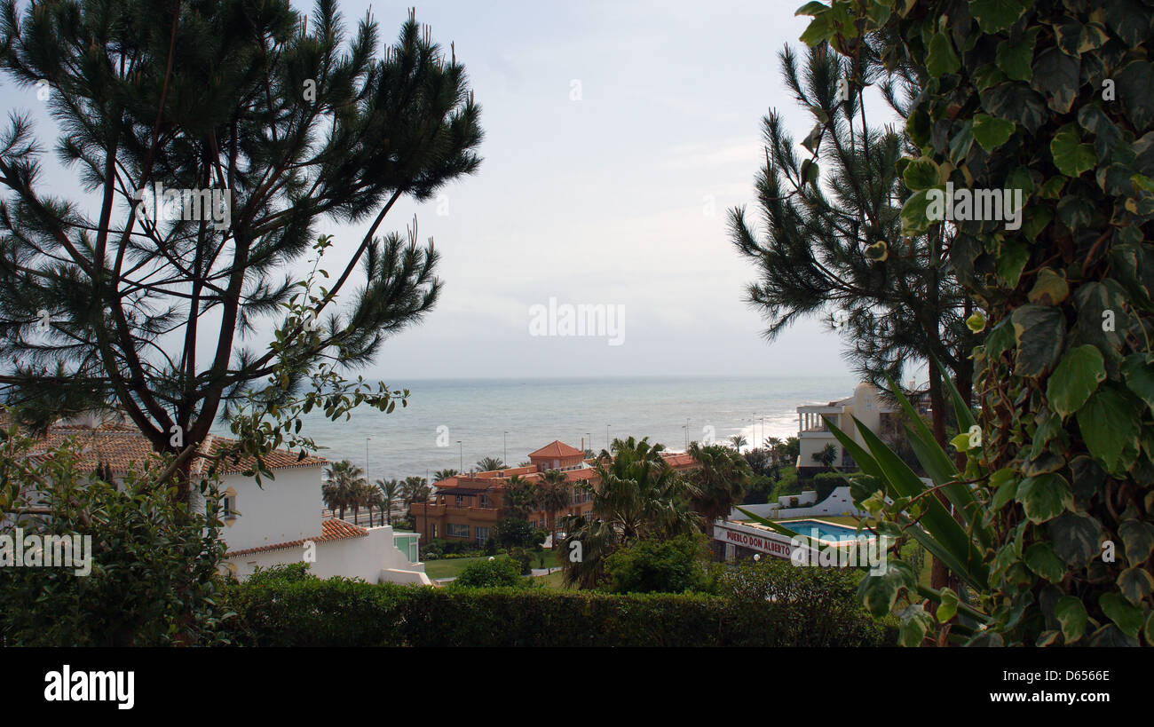 ocean view beach palm trees span holiday resort Stock Photo - Alamy
