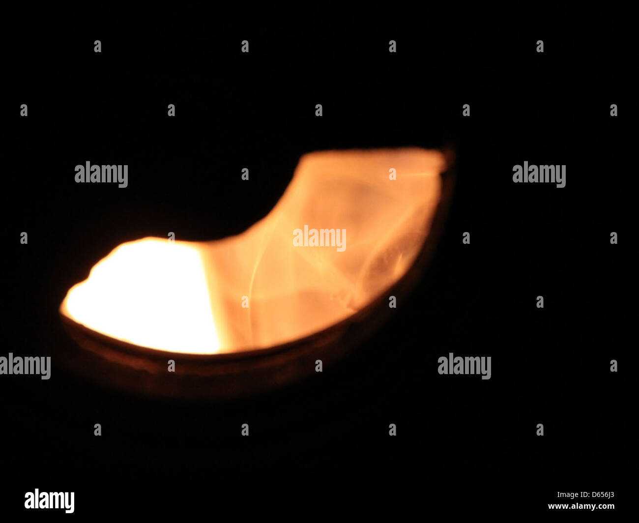 A photo of a fire burning inside a central heating boiler, illustrating ...