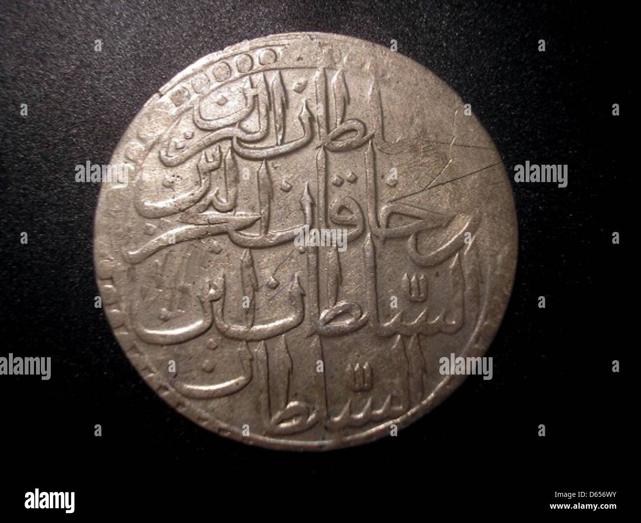 This image shows a collection of old coins, focusing on numismatic ...