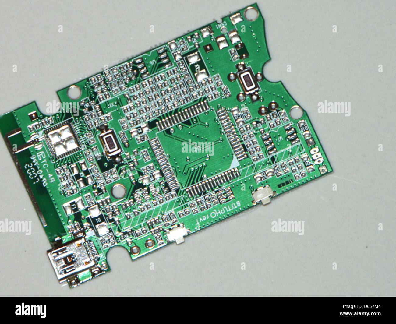 A blank printed circuit board (PCB) is shown, ready for the assembly of ...