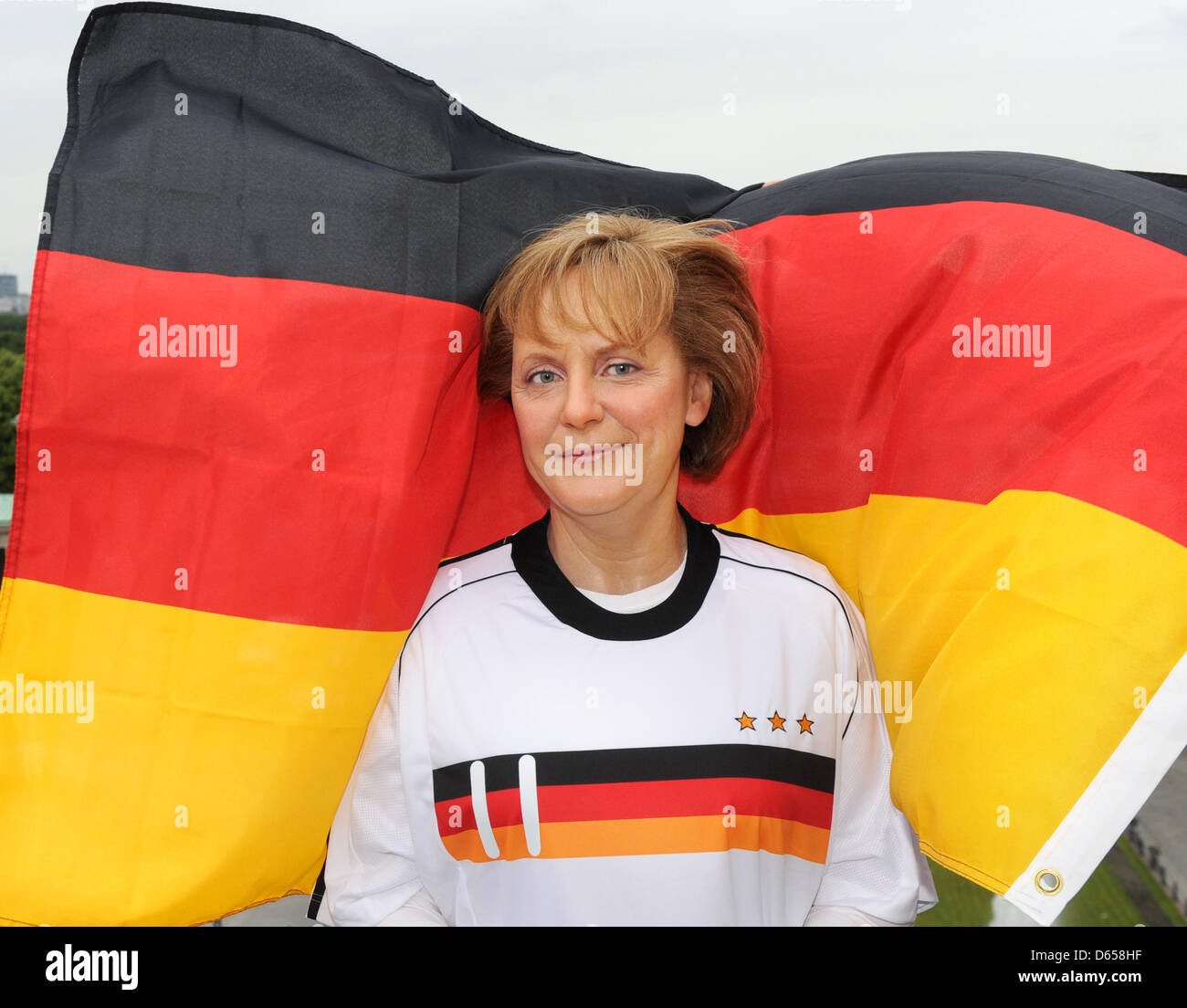 A wax figure of German chancellor Angela Merkel in German soccer team ...