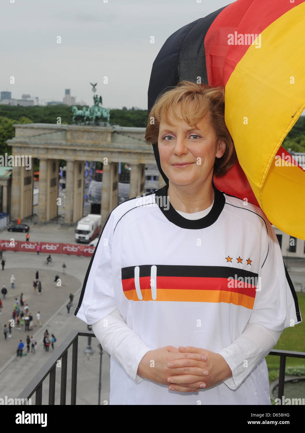 A wax figure of German chancellor Angela Merkel in German soccer team ...