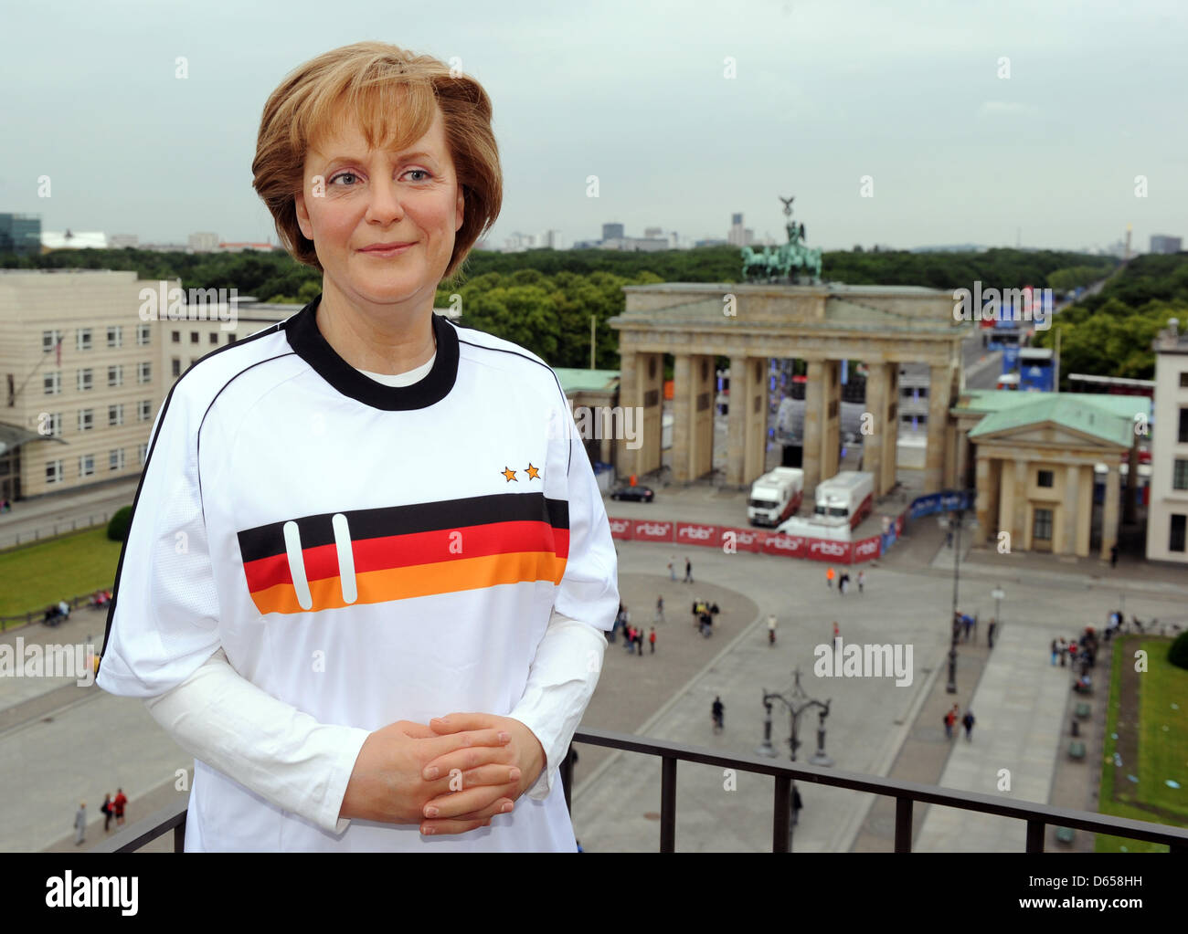 A wax figure of German chancellor Angela Merkel in German soccer team ...