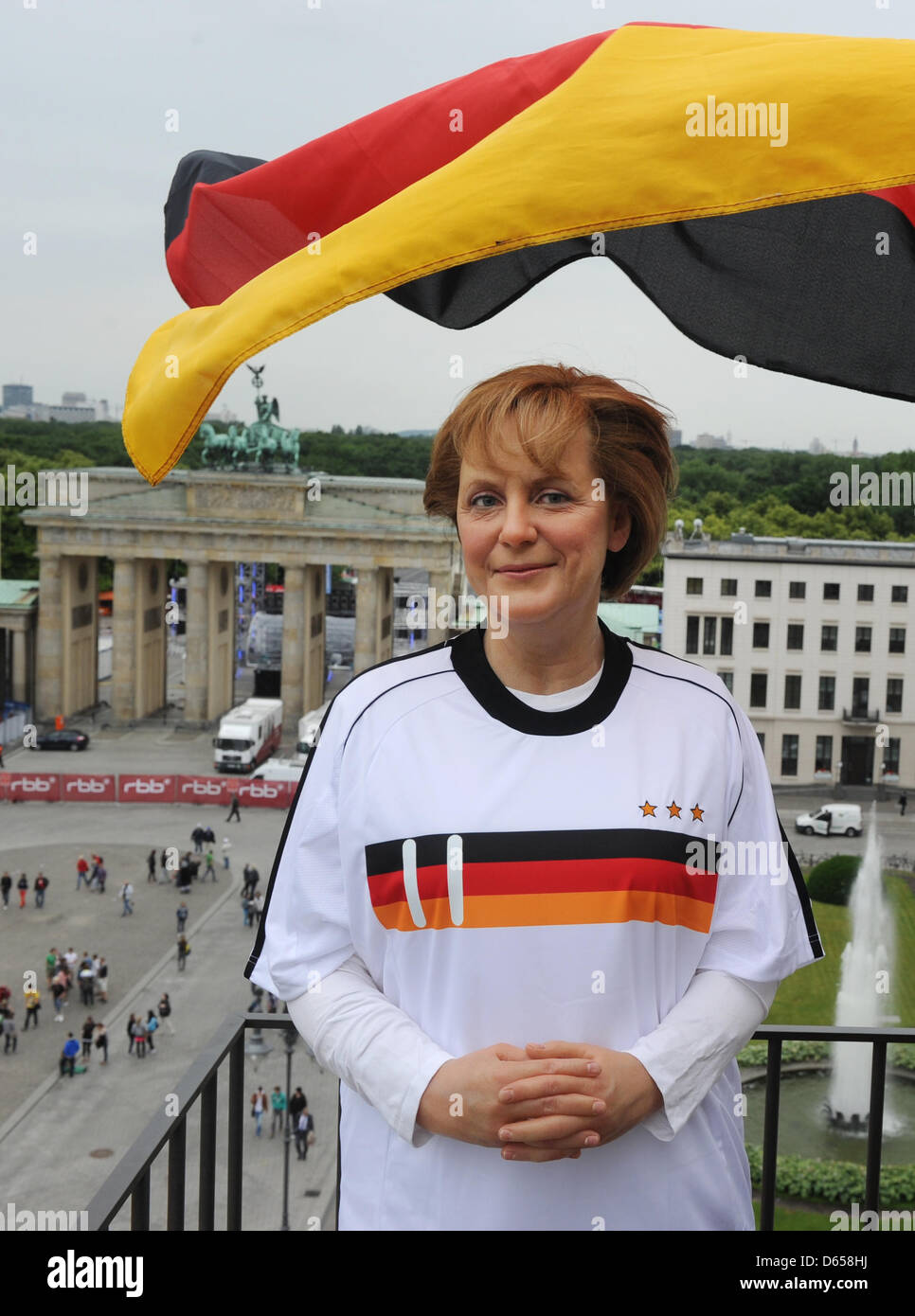 A wax figure of German chancellor Angela Merkel in German soccer team ...