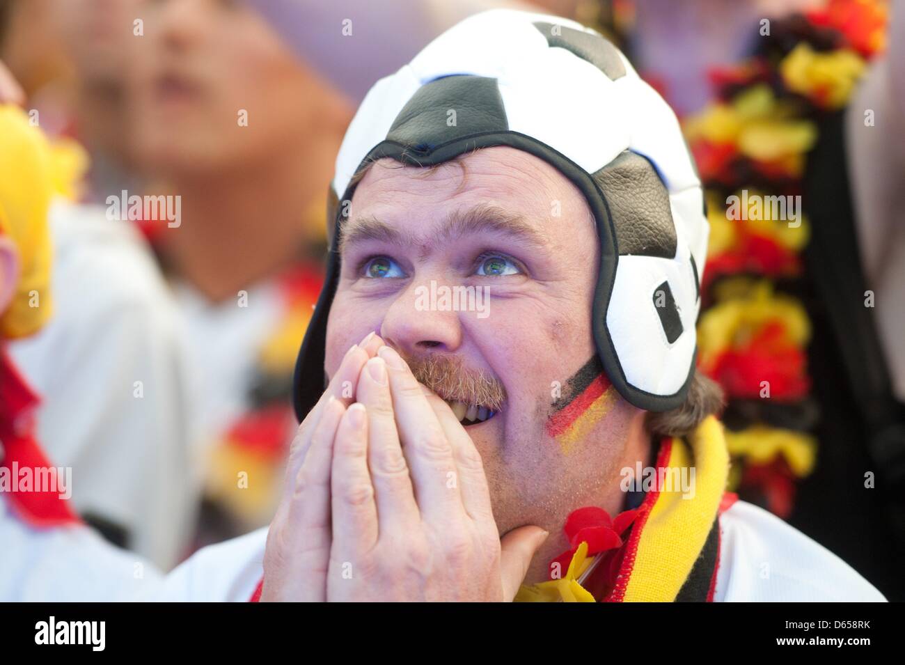 Fans of the German soccer team cheer during a public screening of the ...