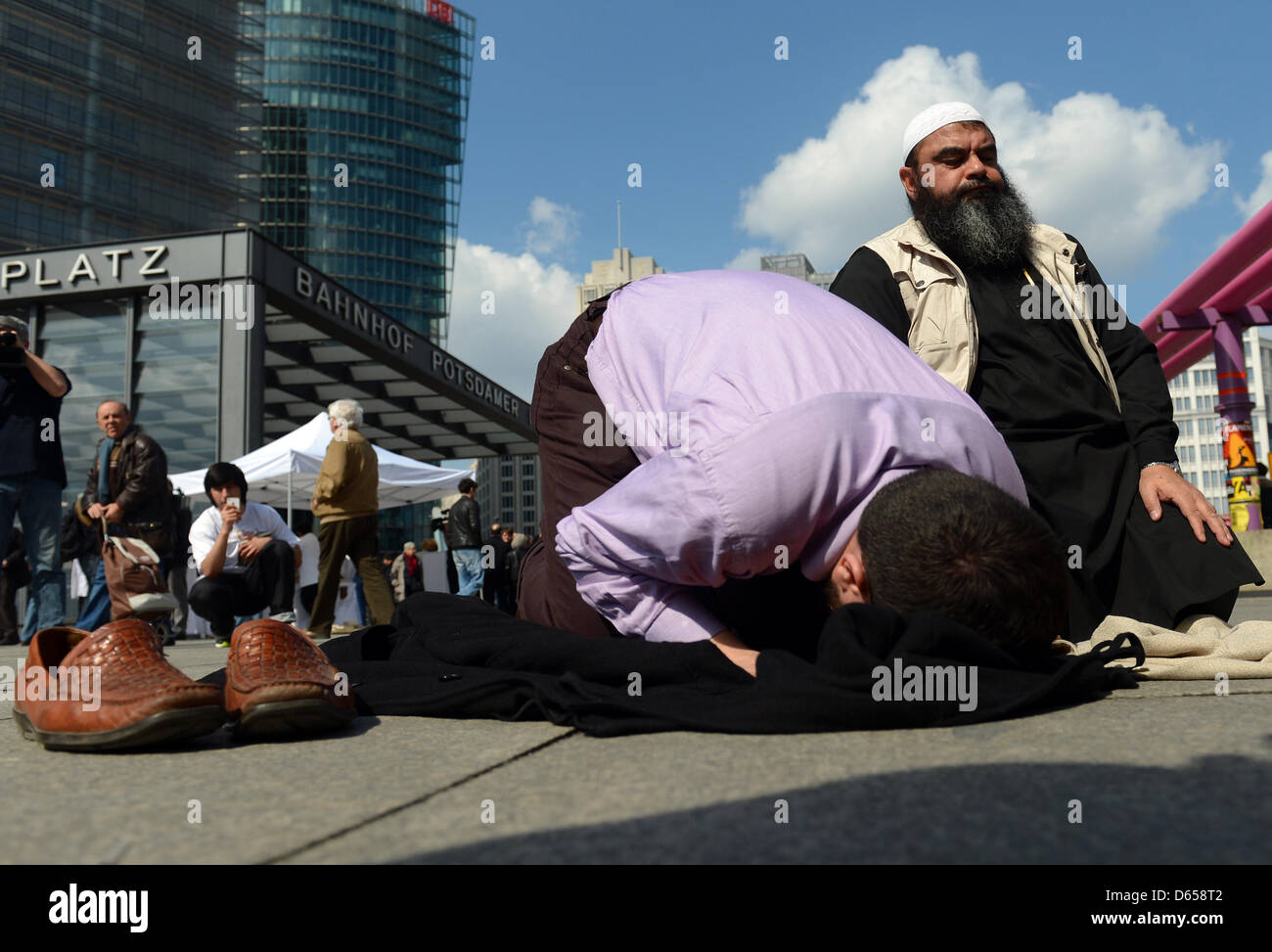 A file picture shows praying muslims on Potsdam Square in Berlin ...