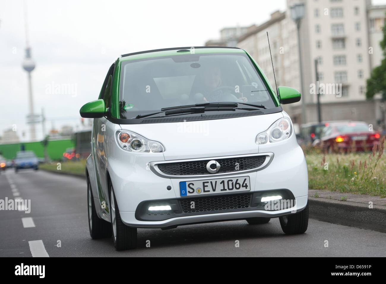 The new electric car of Daimler AG, the smart electric drive, passes in ...