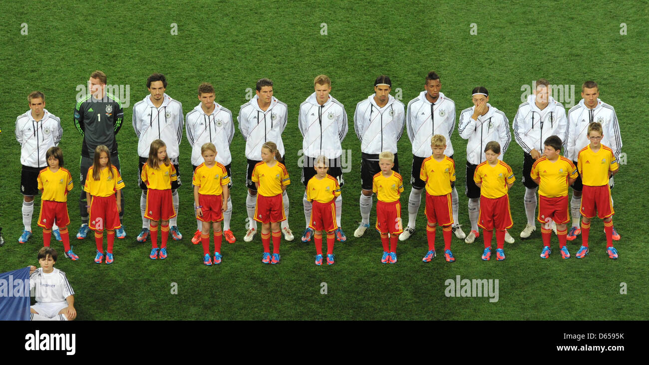 The German starting line-up stands on the pitch during the national ...
