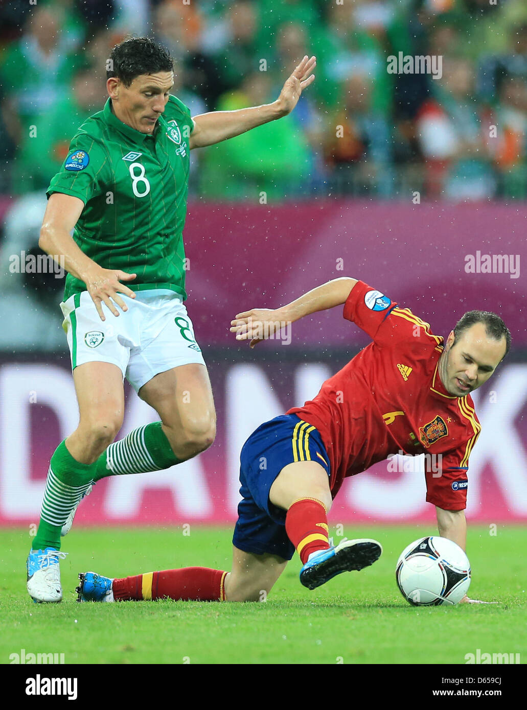 Spain's Andres Iniesta (R) and Ireland's Kevin Andrews vie for the ball ...