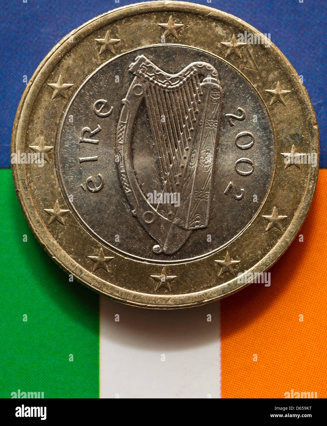 A one Euro coin is pictured next to an Irish flag in Frankfurt, Germany ...