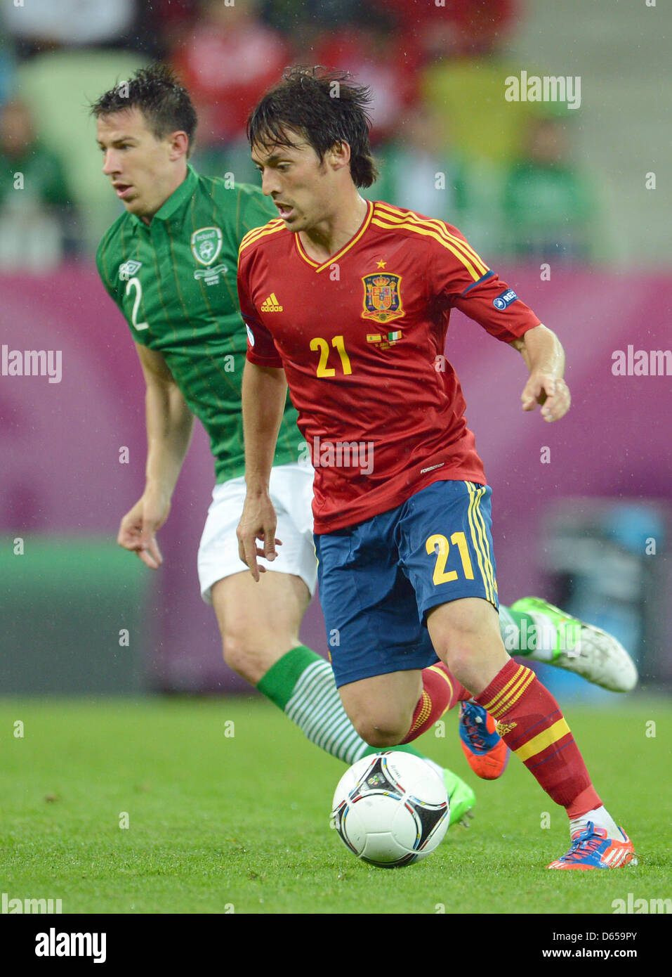 Spain's David Silva (R) and Ireland's Sean St. Ledger fight for the ...