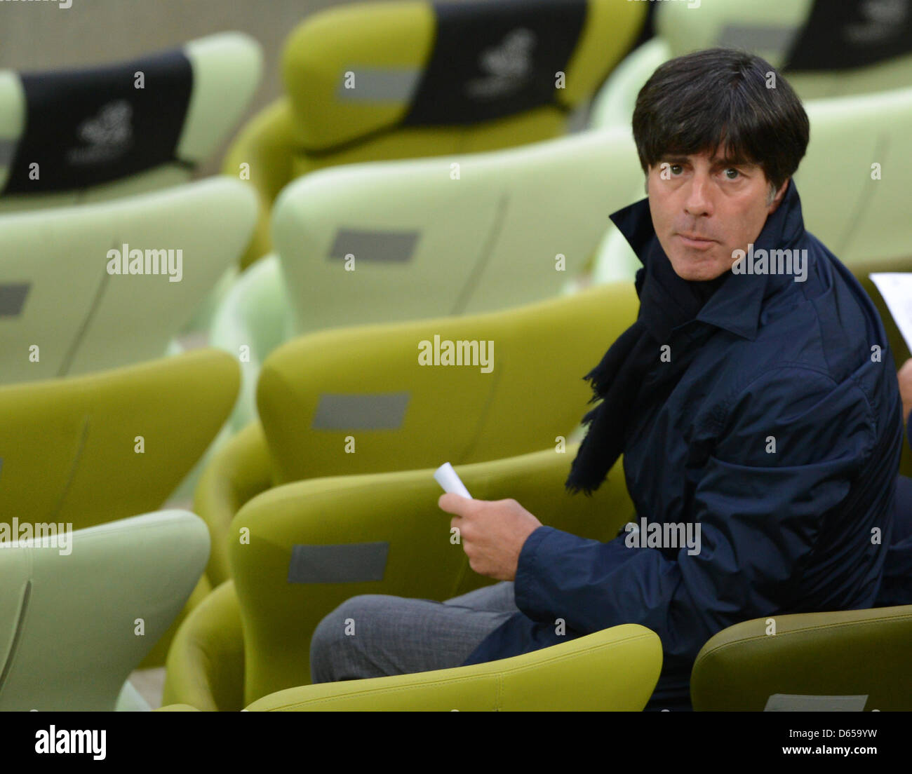 Germany's head coach Joachim Loew sits on the stands before the UEFA ...