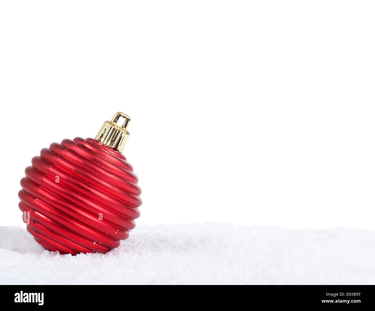The christmas tree ball in snow Stock Photo - Alamy