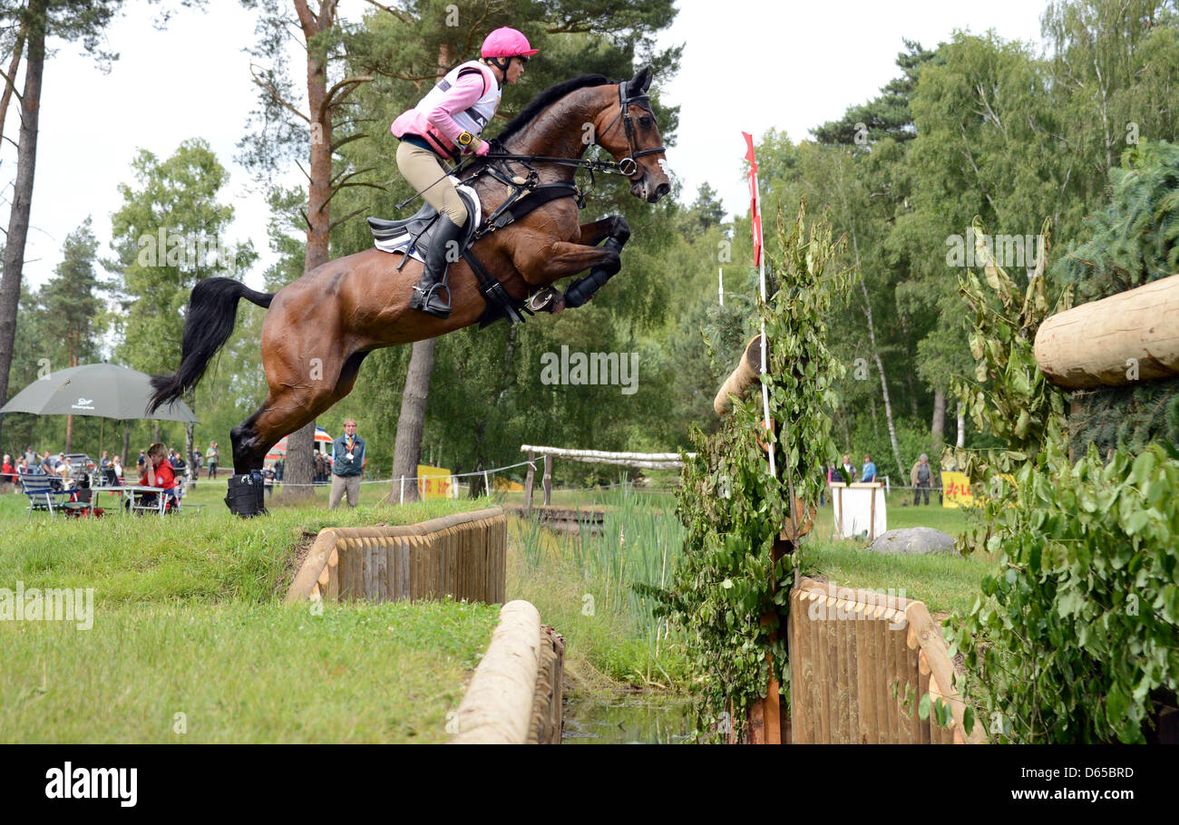 Australian cross country rider Lucinda Fredericks jumps across an ...
