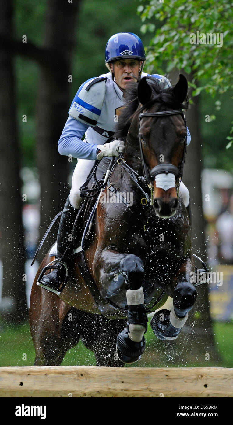 US cross country rider Andrew Hoy jumps across an obstacle with his ...