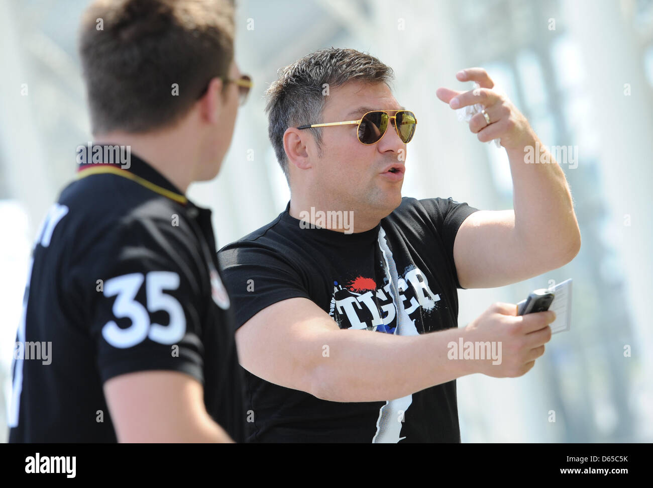 Former boxing champion Dariusz Michalczewski and his son Nicolas arrive ...