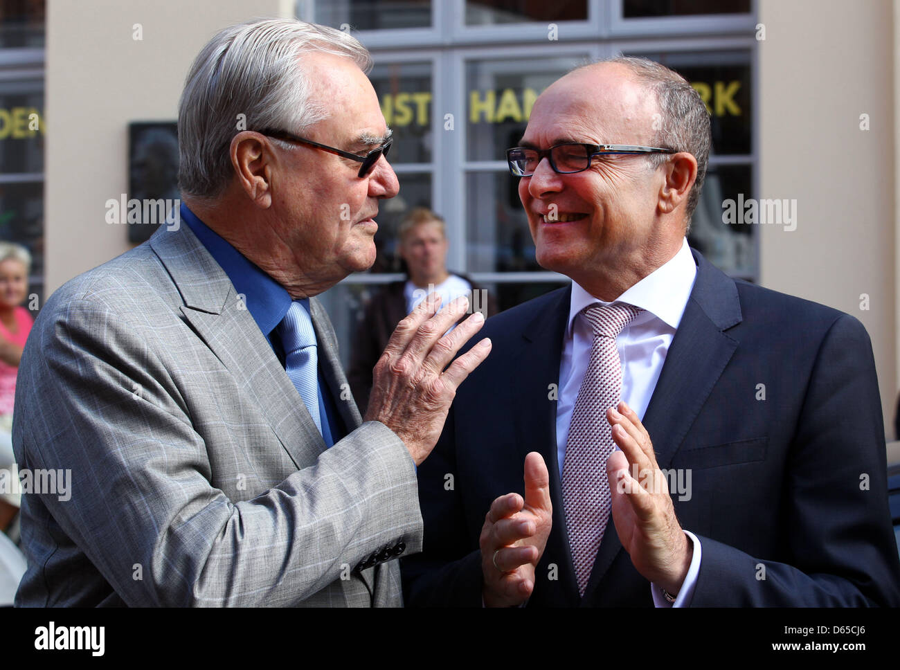 Premier of Mecklenburg-Western Pomerania Erwin Sellering (SPD, R) talks ...