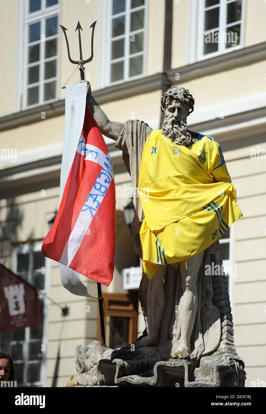 A Neptune statue wears a Ukrainian jersey and a Danish flag in downtown ...