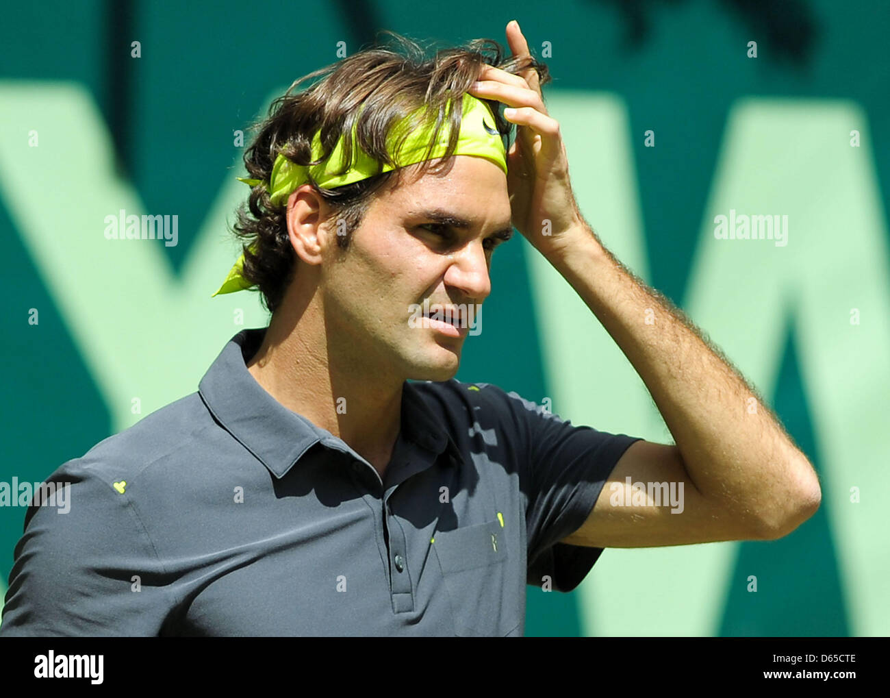Swiss tennis player Roger Federer touches his head during the final of ...