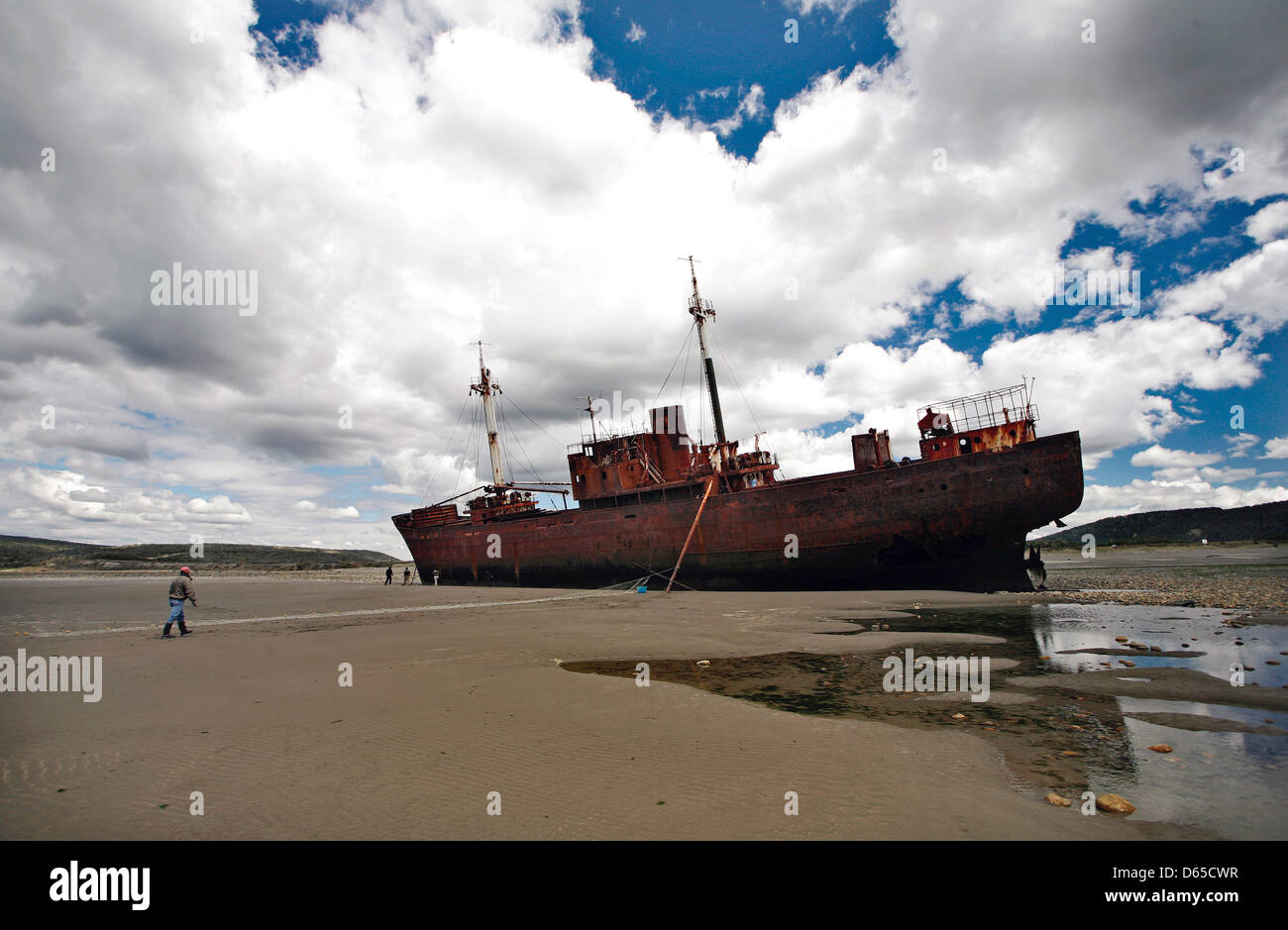 Tourists view the beached shipwreck of the Desdemona near San Pablo ...