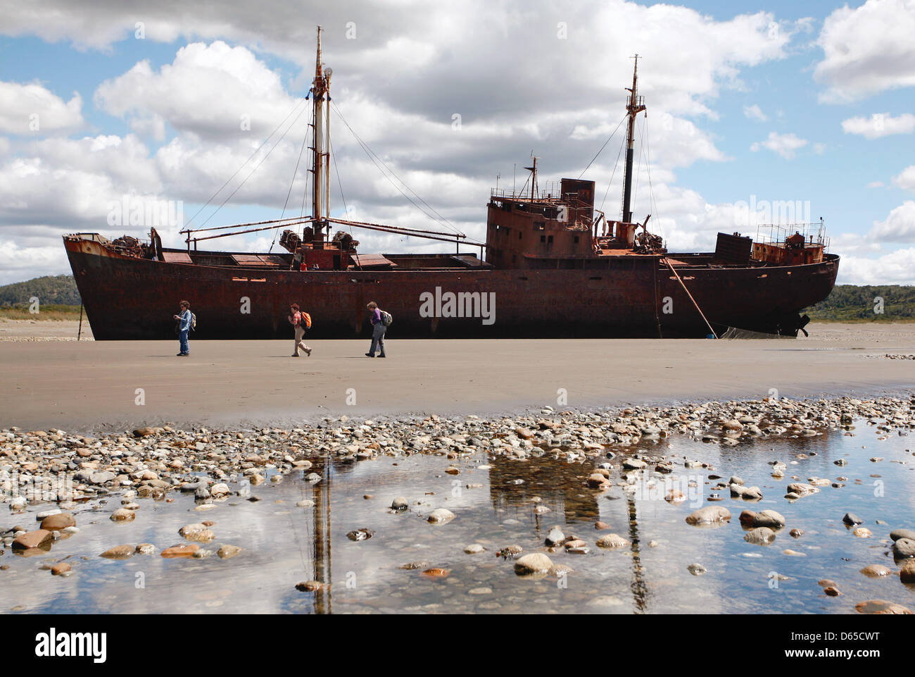 Tourists view the beached shipwreck of the Desdemona near San Pablo ...
