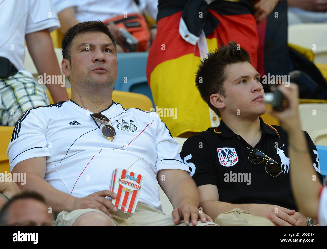Former boxing champion Dariusz Michalczewski and his son Nicolas sit on ...