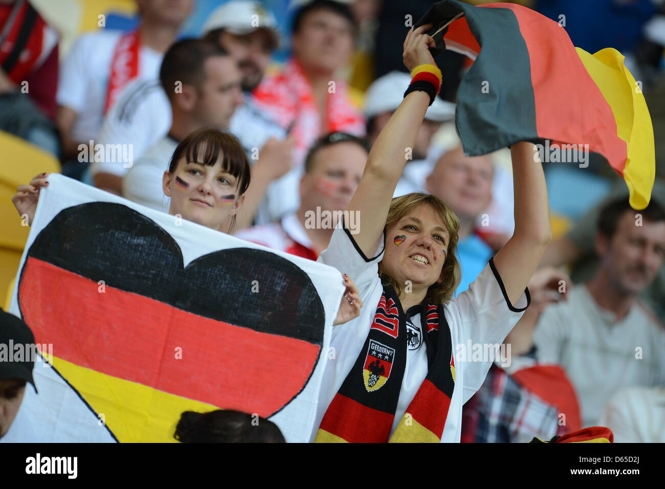 German supporters cheer for their team before the UEFA EURO 2012 group ...