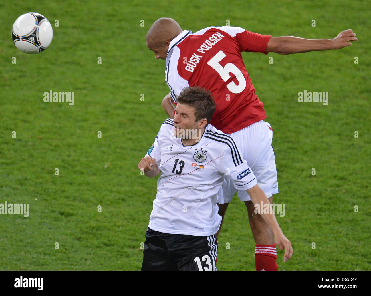 Denmark's Simon Poulsen (top) and Germany's Thomas Mueller vie for the ...