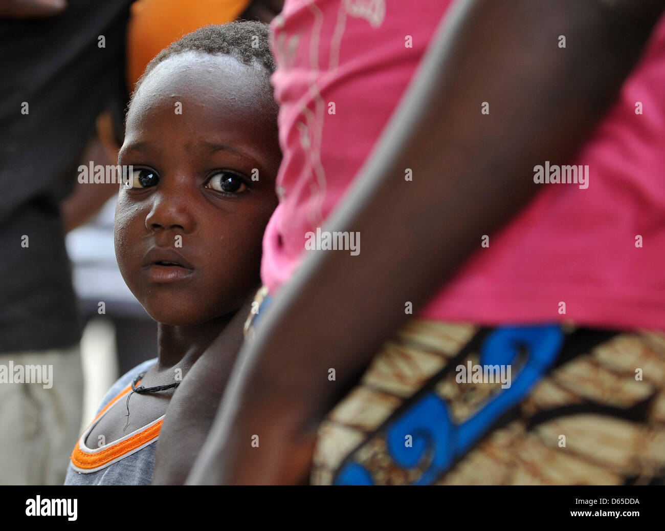 FILE - A file photo dated 29 June 2011 shows a child in the slums of ...