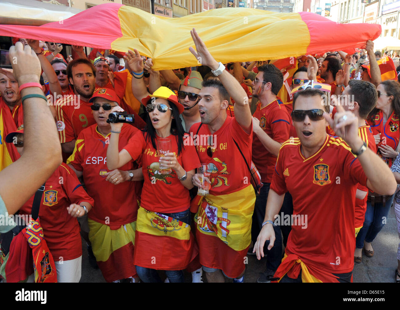 Spanish football supporters celebrate in the city center of Gdansk ...