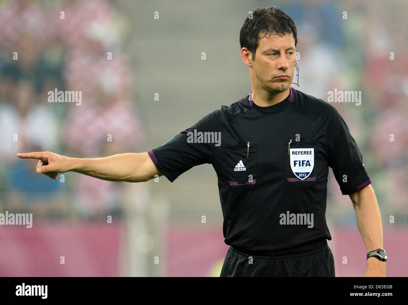 German referee Wolfgang Stark gestures during UEFA EURO 2012 group C ...