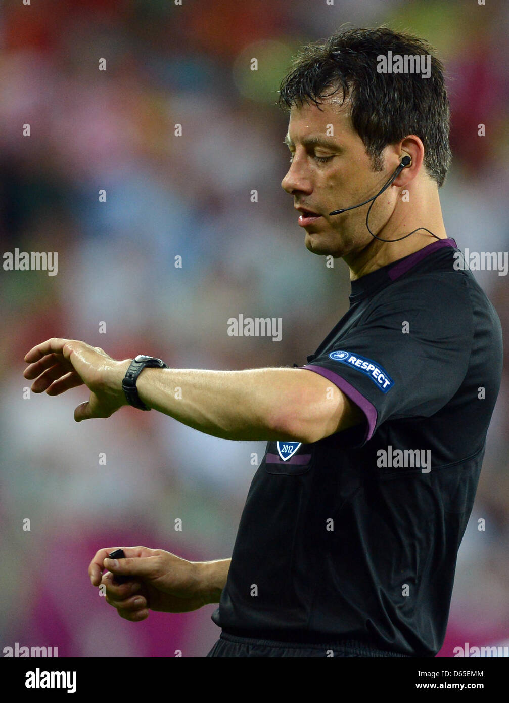German referee Wolfgang Stark looks at his wristwatch during UEFA EURO ...