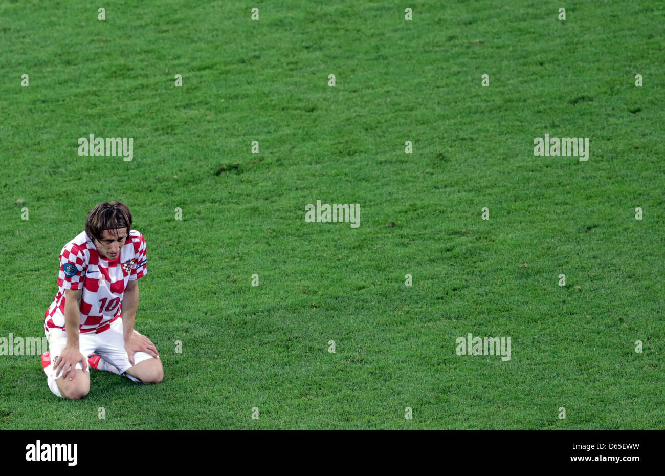 Croatia's Luka Modric kneels on the pitch after UEFA EURO 2012 group C ...