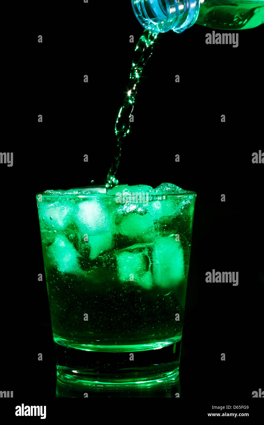 Green drink pouring in a glass Stock Photo - Alamy