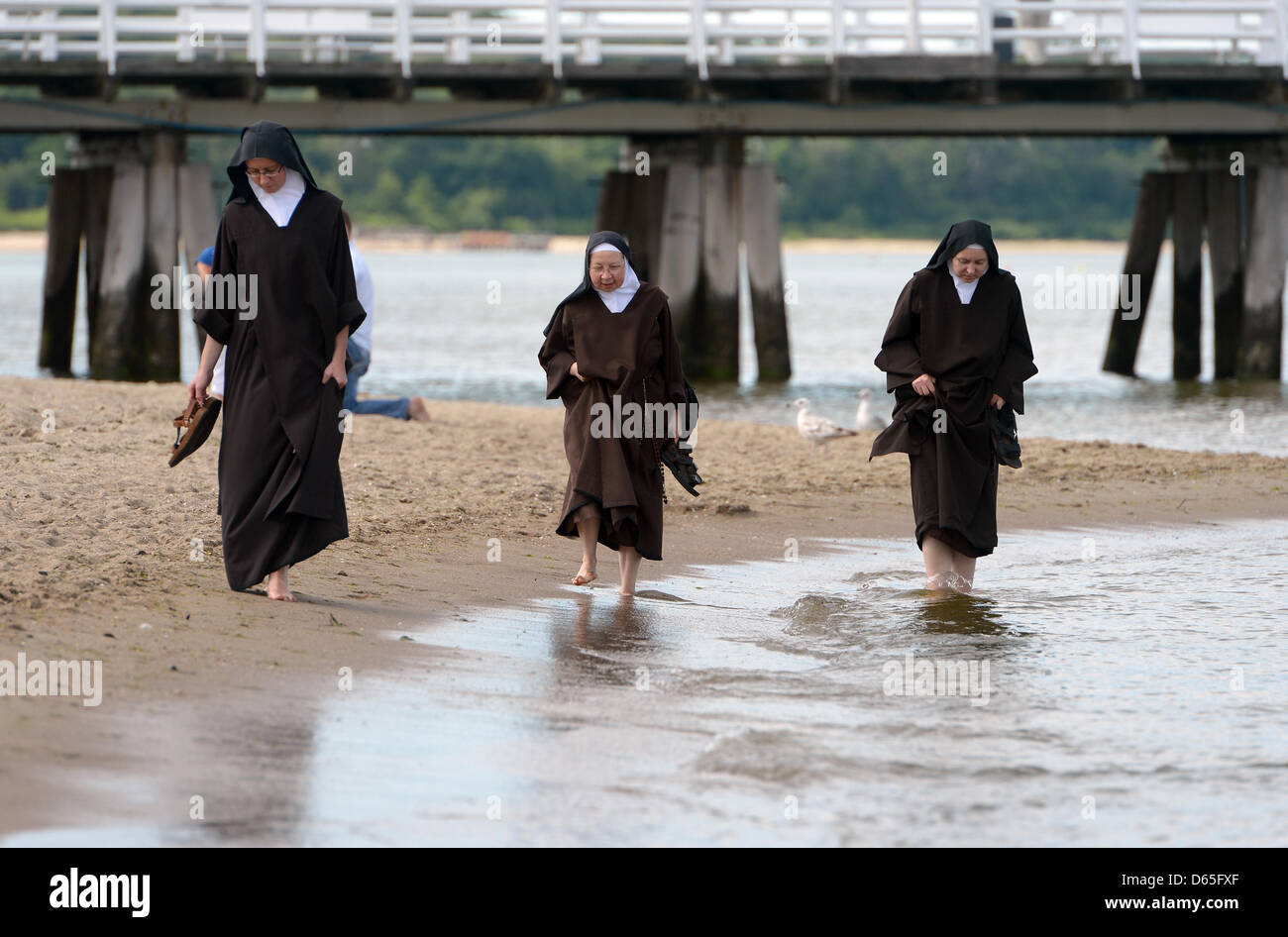 Three nuns take a walk on the beach in Sopot, Poland, 19 June 2012 ...