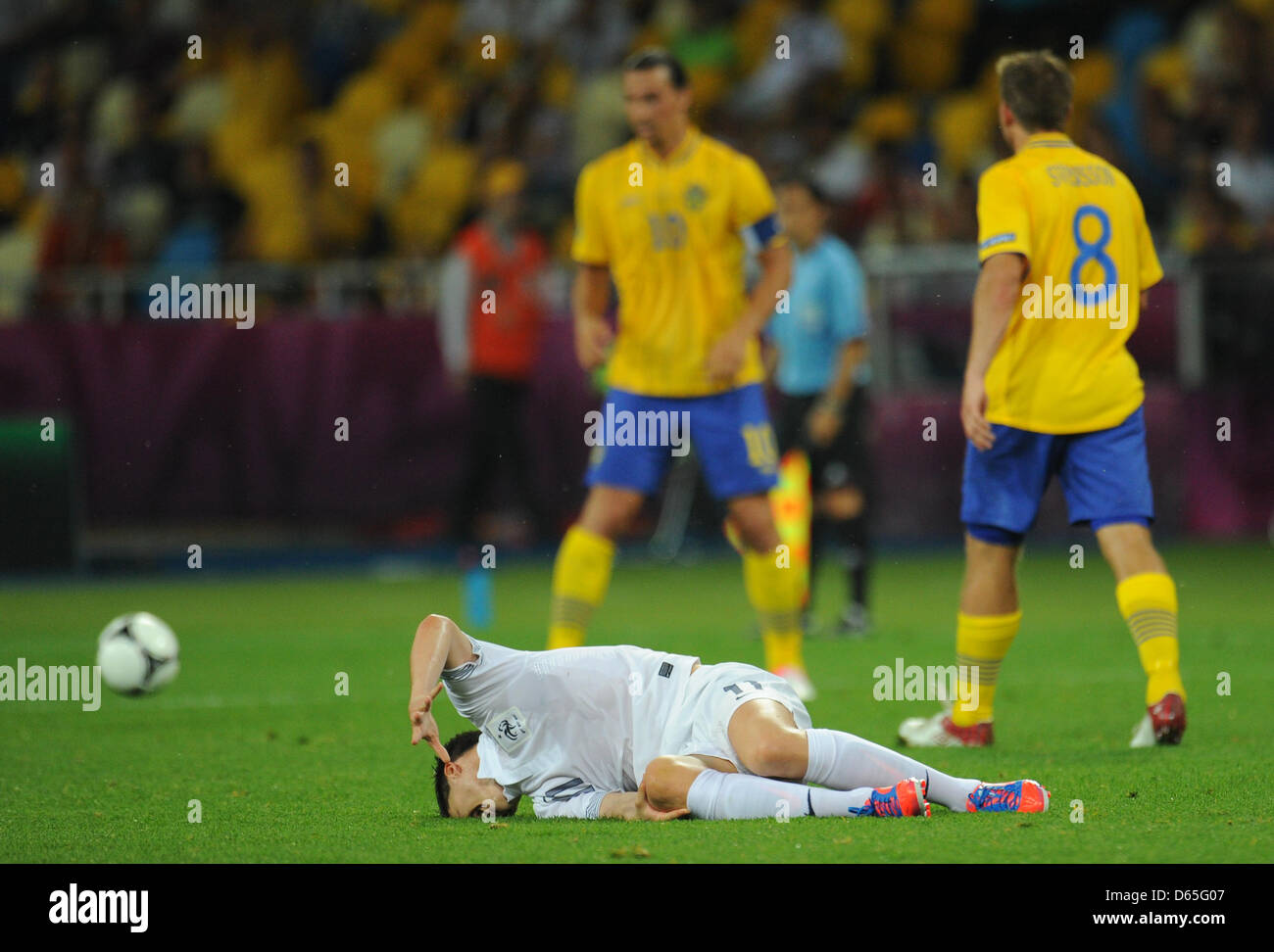 France's Samir Nasri lies on the pitch during UEFA EURO 2012 group D ...