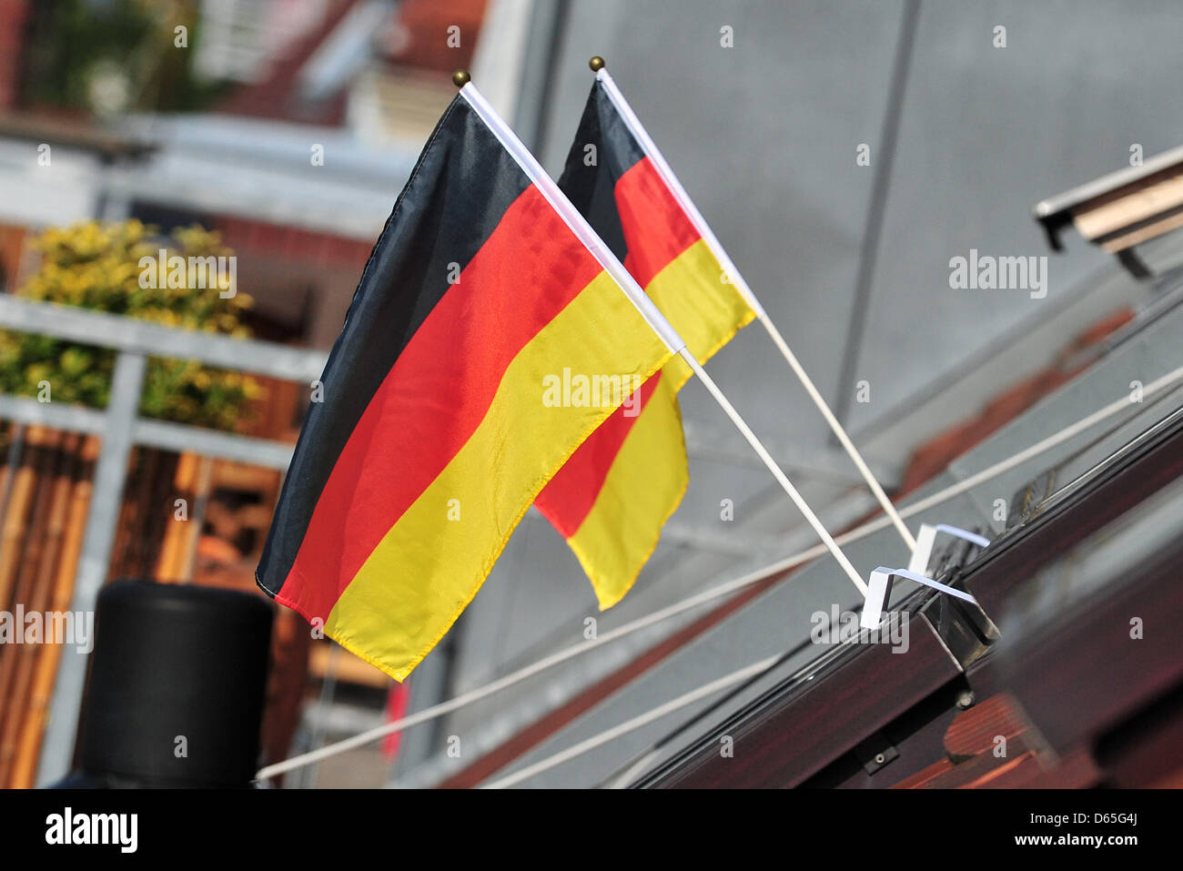 A Germany flag flies at a window in Stuttgart, Germany, 15 June 2012 ...