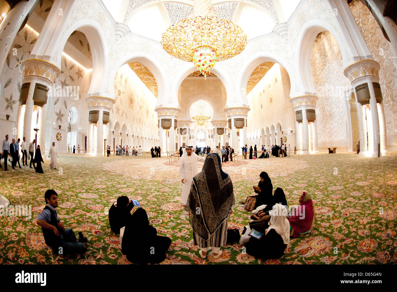 Tourists visit Sheikh Zayed Mosque in Abu Dhabi, United Arab Emirates ...