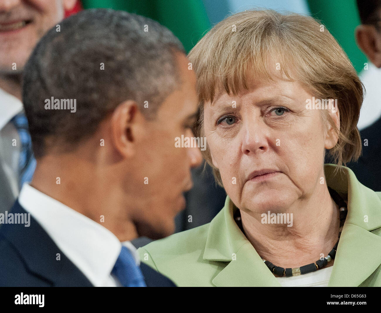 US President Barack Obama and German Chancellor Angela Merkel talk ...