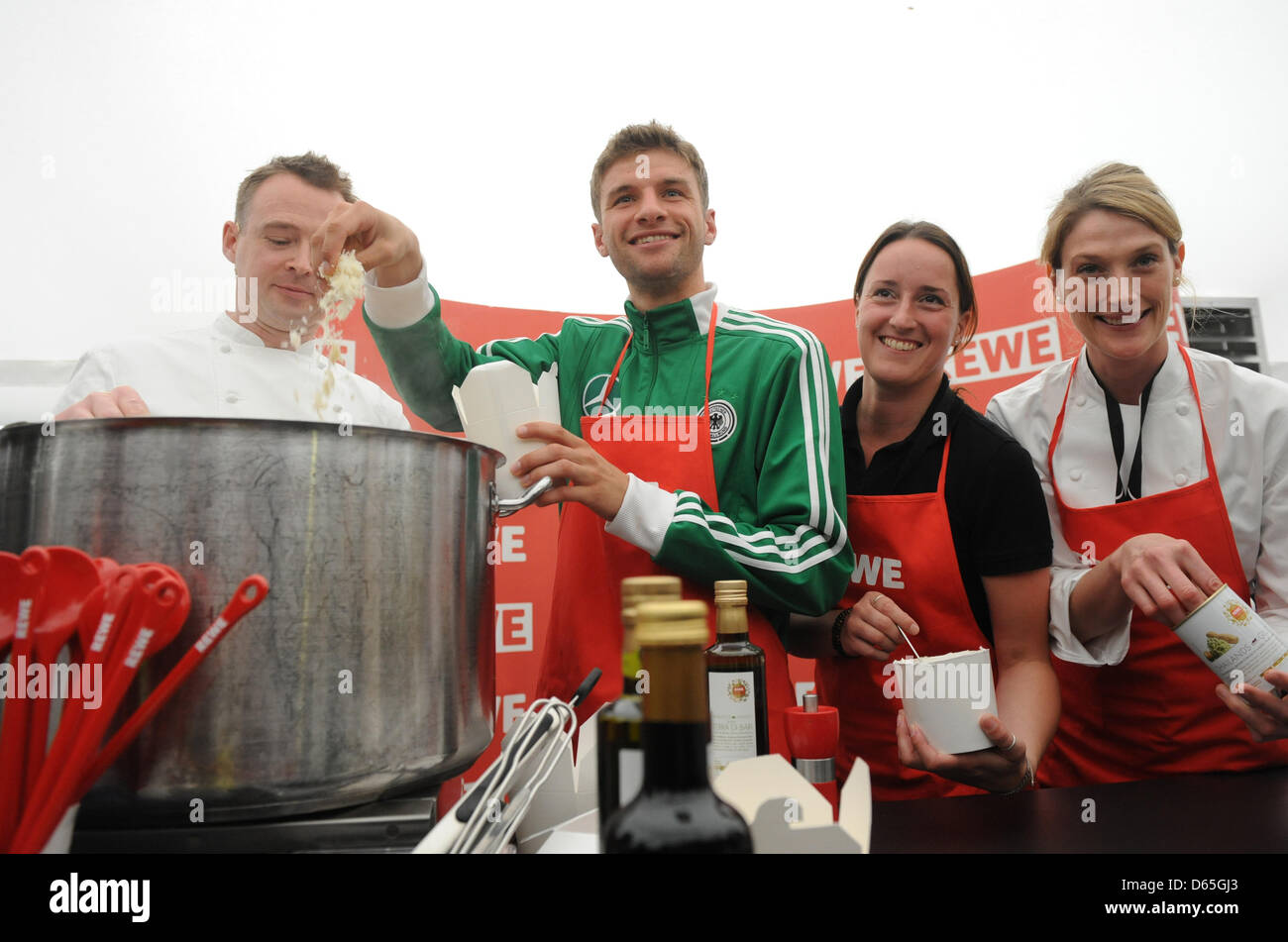 Germany's national soccer player Thomas Mueller (2-L) and Holger ...