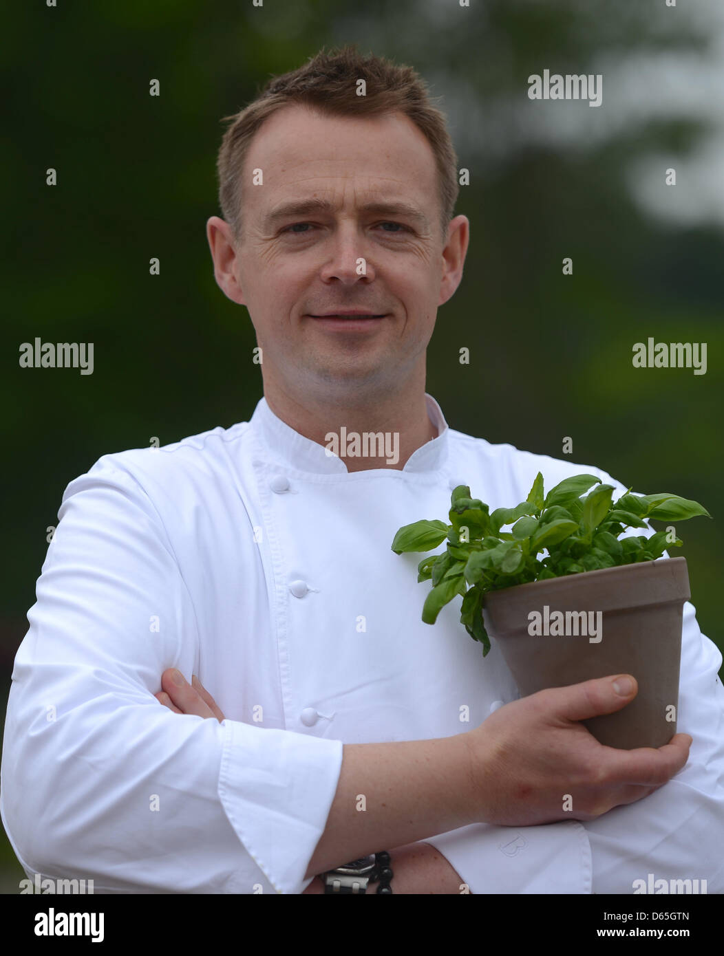 The cook of the German soccer team, Holger Stromberg, poses after a ...