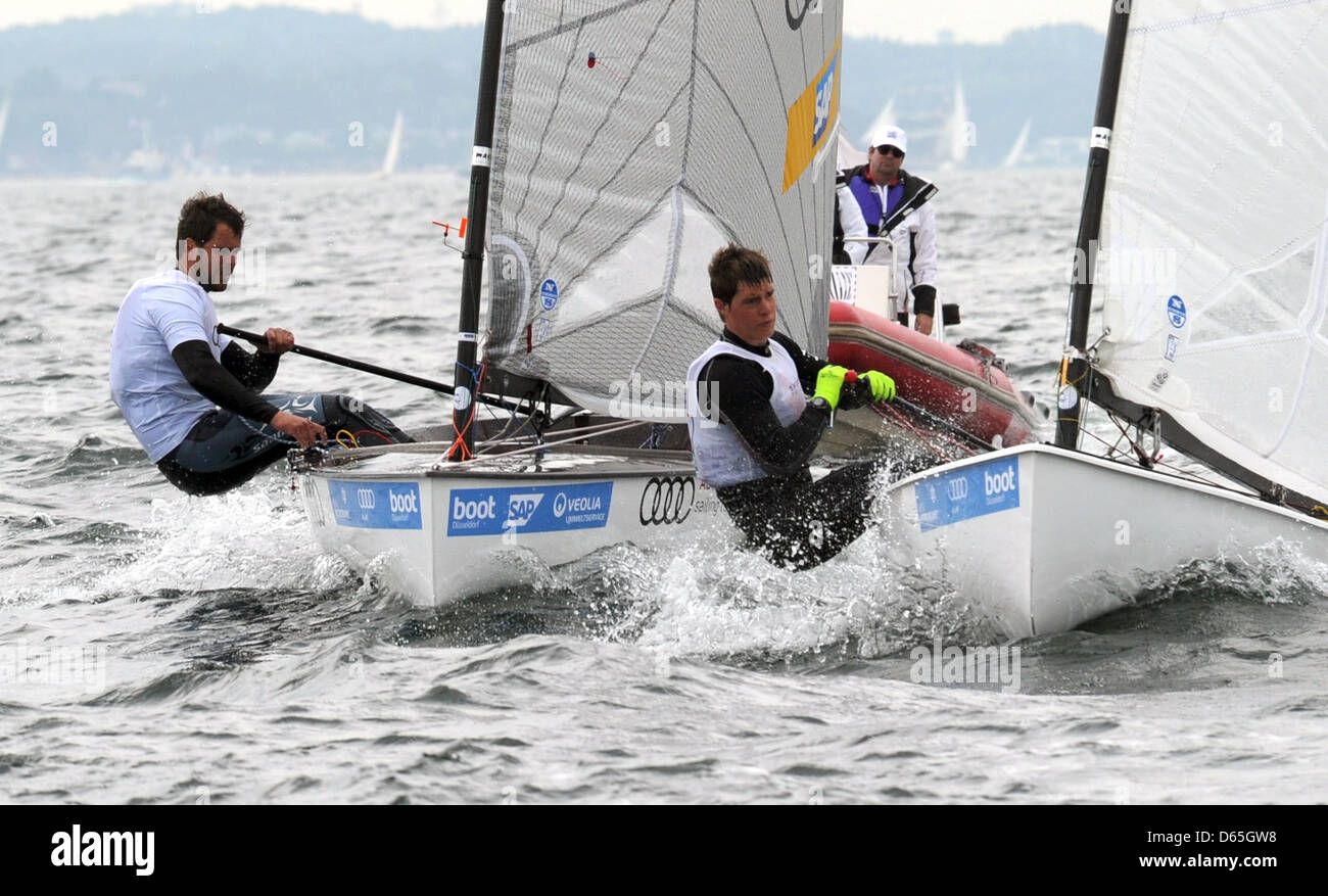 German sailor Matthias Miller (L) sail with his Finn class sailboat ...