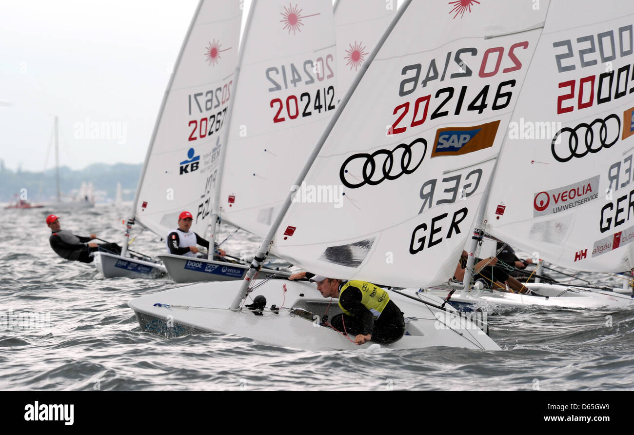 Sailors with Laser class boats take part in a "Medal Race" during Kiel ...