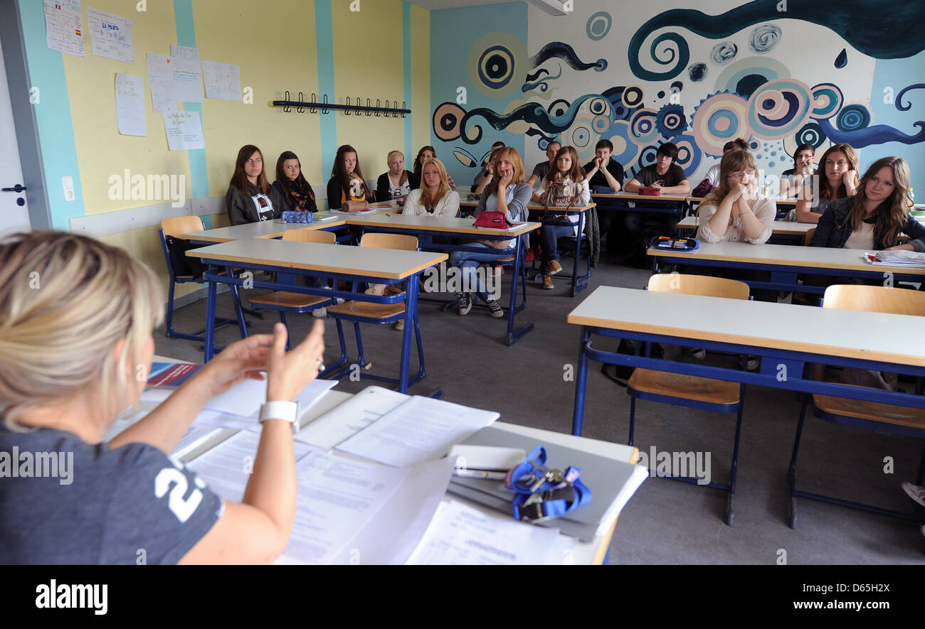 A English teacher gives a lesson in an tenth grade class at the ...