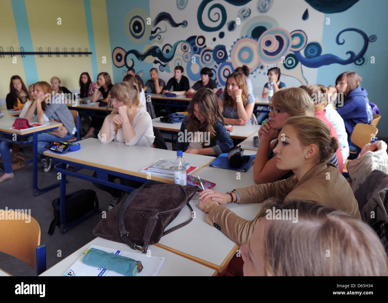 A English teacher gives a lesson in an tenth grade class at the ...