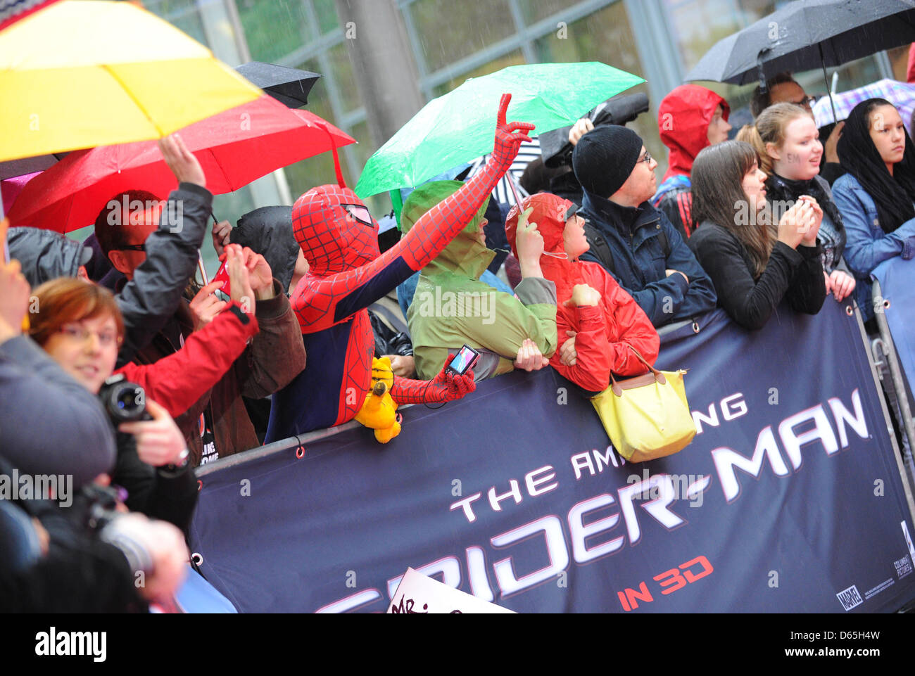 A fan in a Spider Man costume waves in the crowd during the premiere of ...