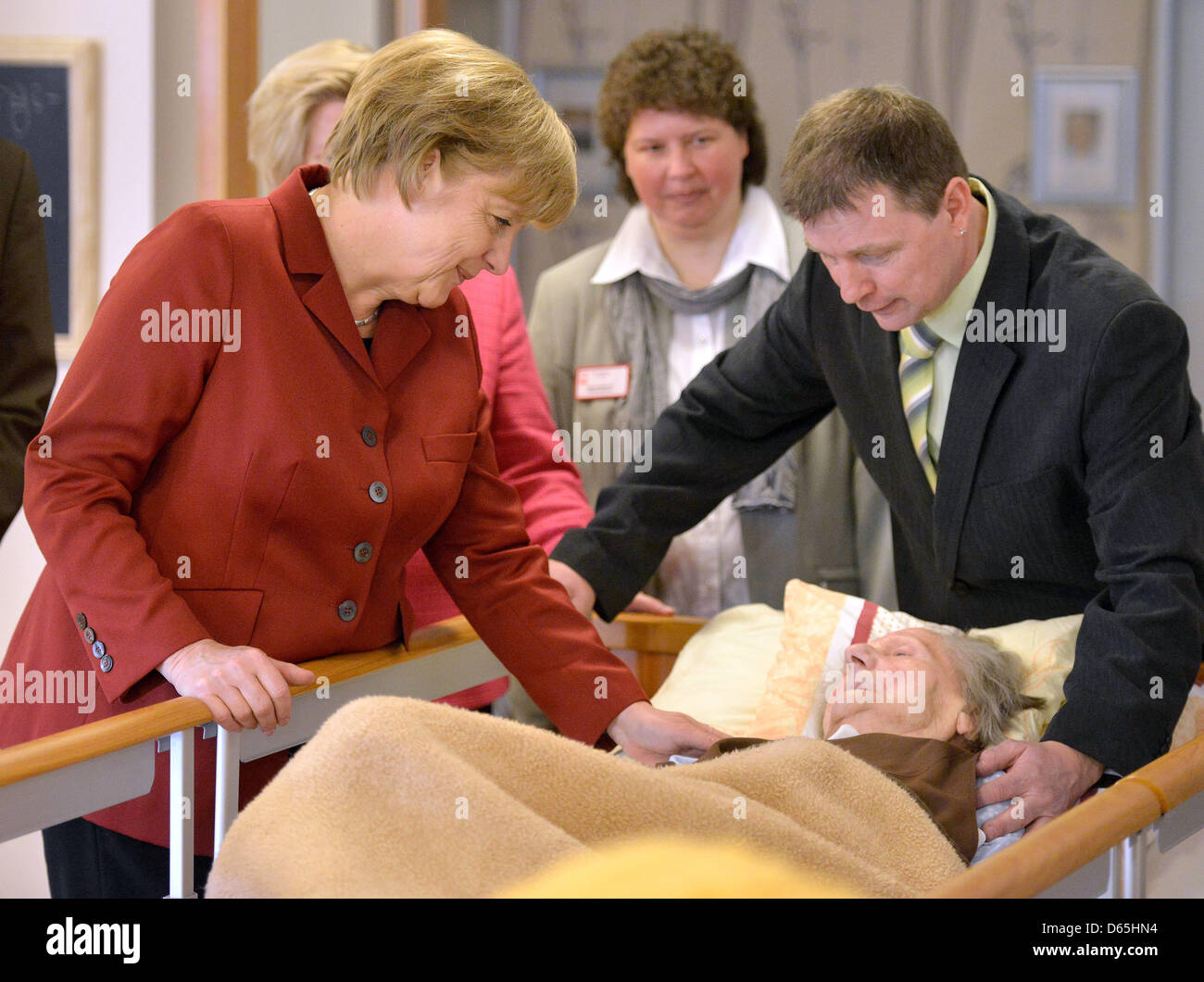 Melle, Germany. 12th April 2013. German Chancellor Angela Merkel greets ...